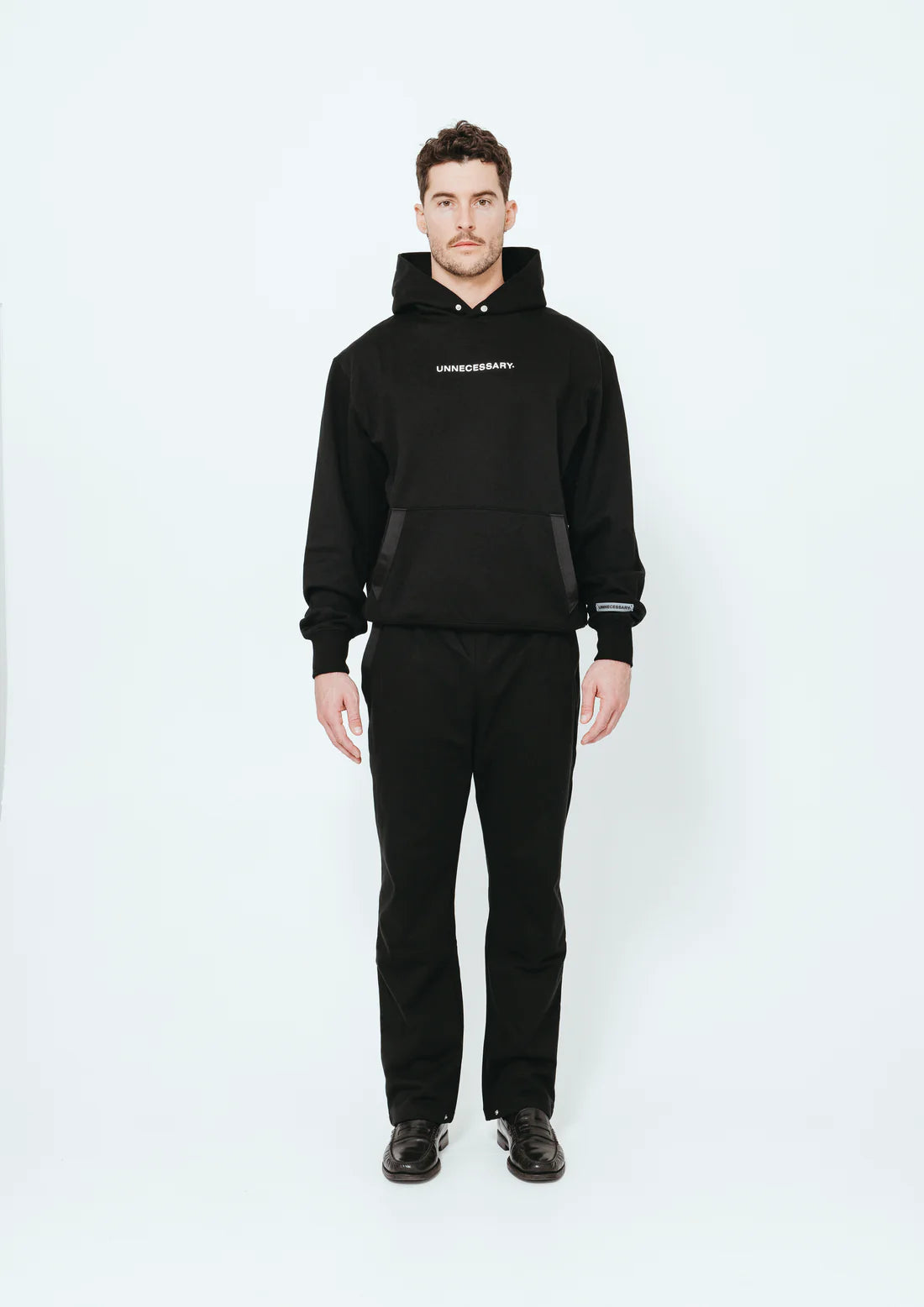 UNNECESSARY Logo Hoodie Black – Cabinet Noir