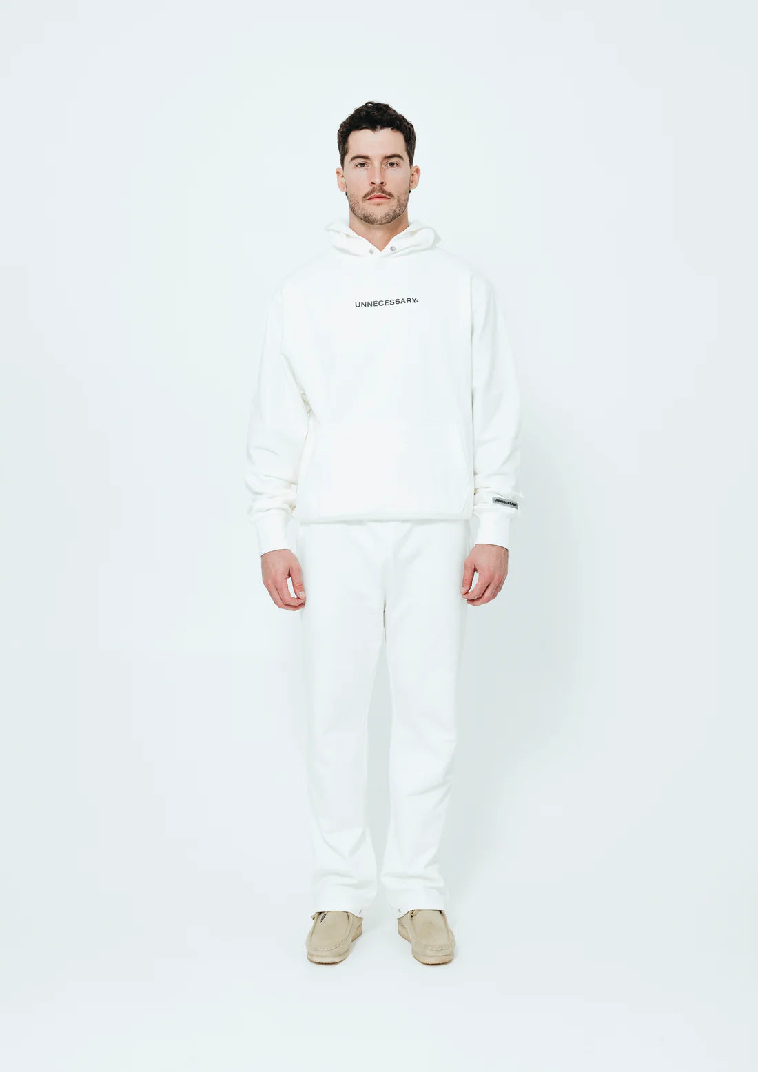UNNECESSARY Logo Hoodie Bone White – Cabinet Noir